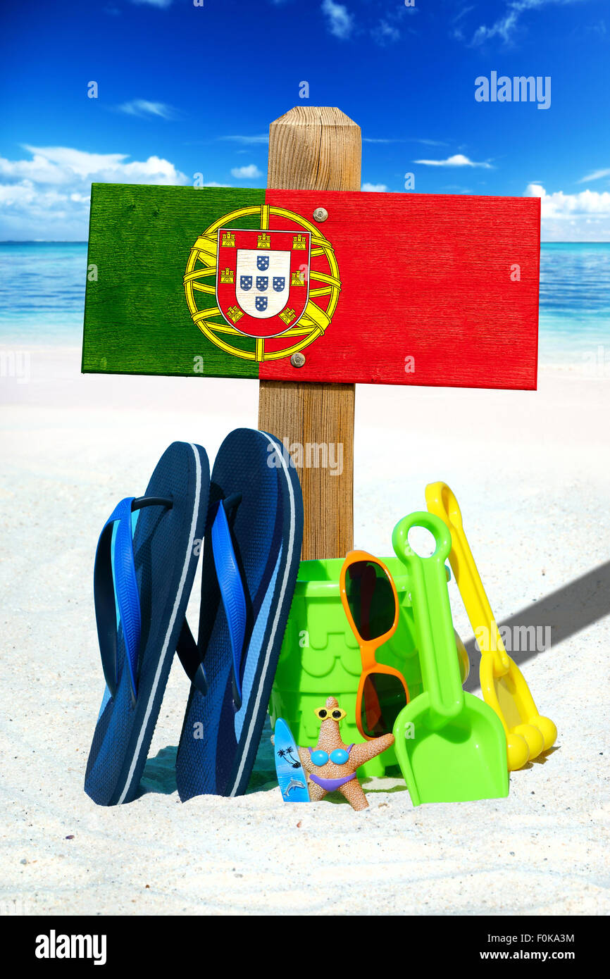 Wooden signboard with the Portugal flag, blue flip flops and colorful ...