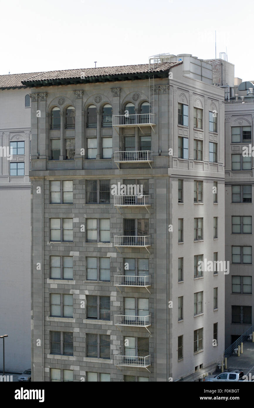 Eight story gray brick building Stock Photo - Alamy