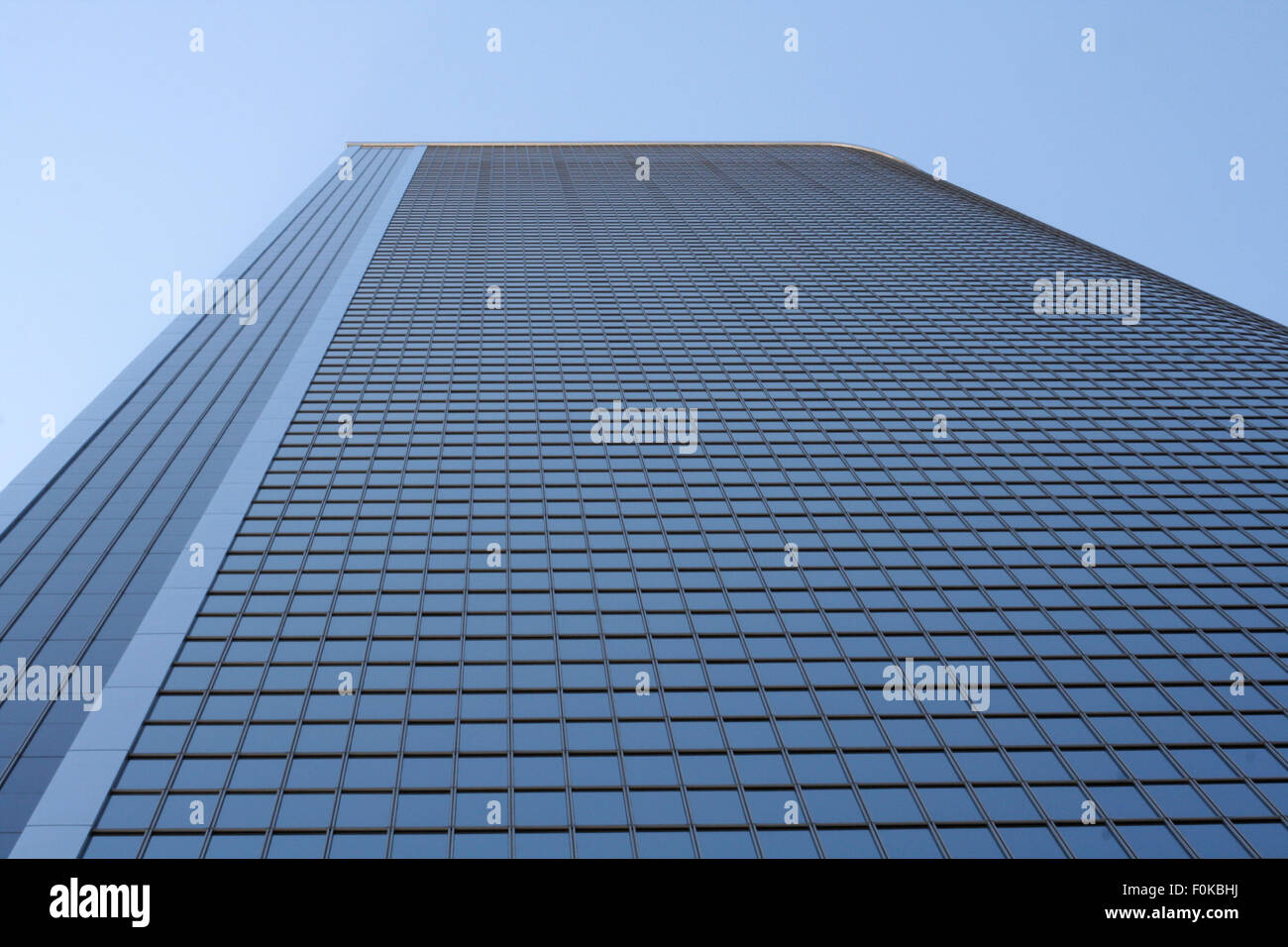 Blue glass grid high rise building from low angle Stock Photo - Alamy