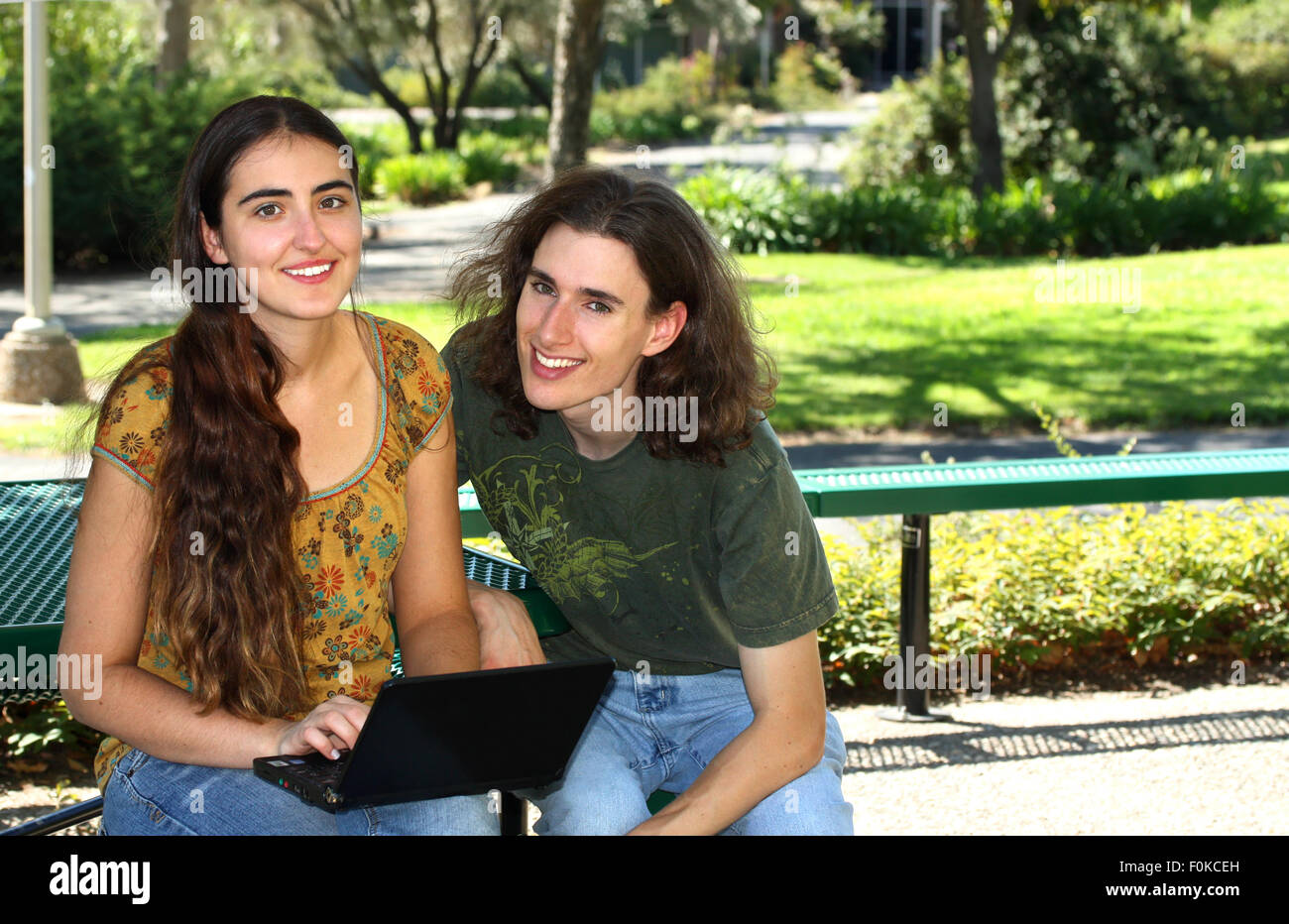 Young students using laptop at college campus Stock Photo - Alamy