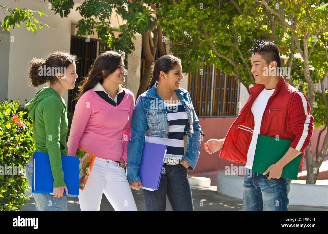 Happy teenage girls talking class hi-res stock photography and images ...