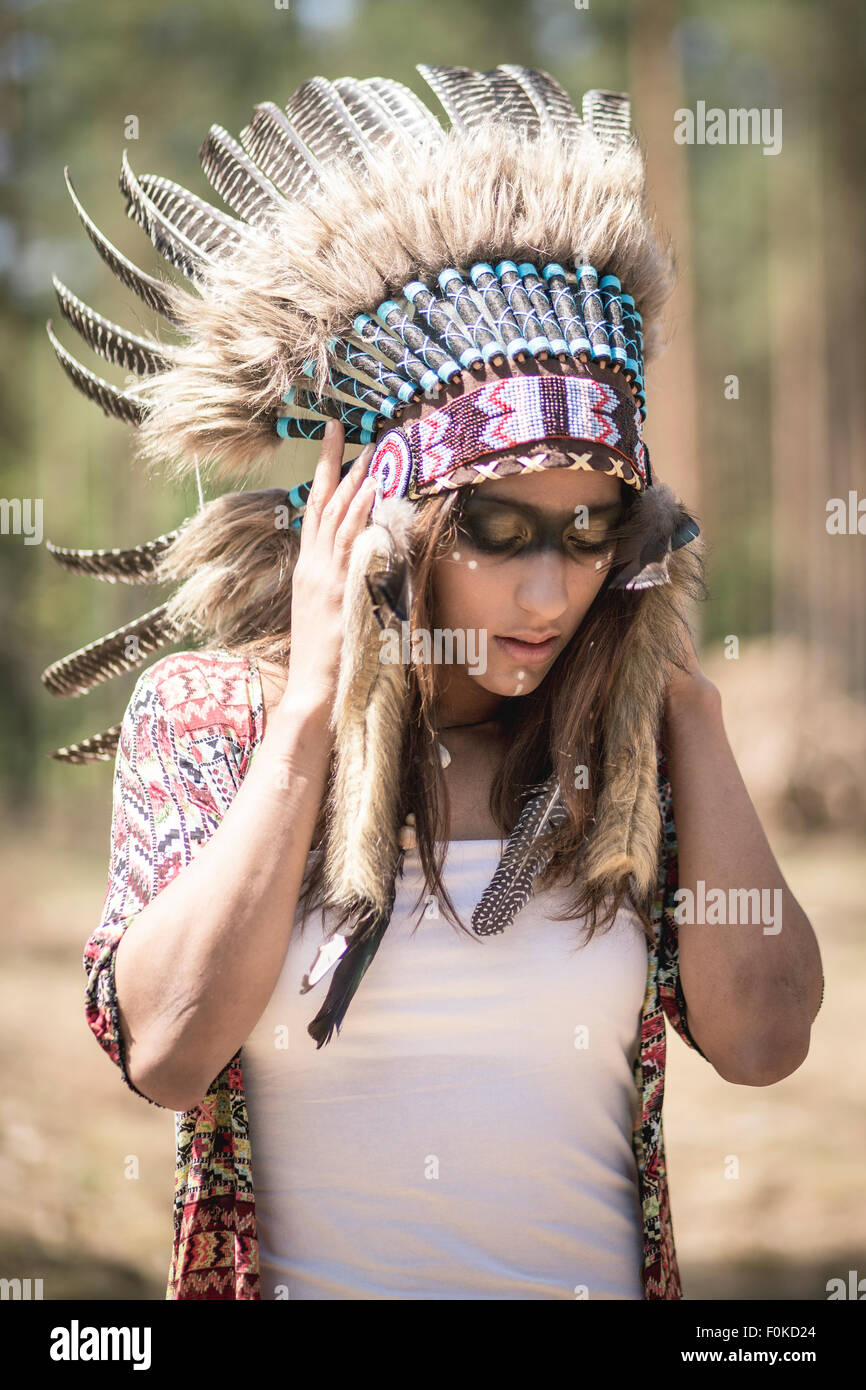 Young woman masquerade as an Indian Stock Photo - Alamy
