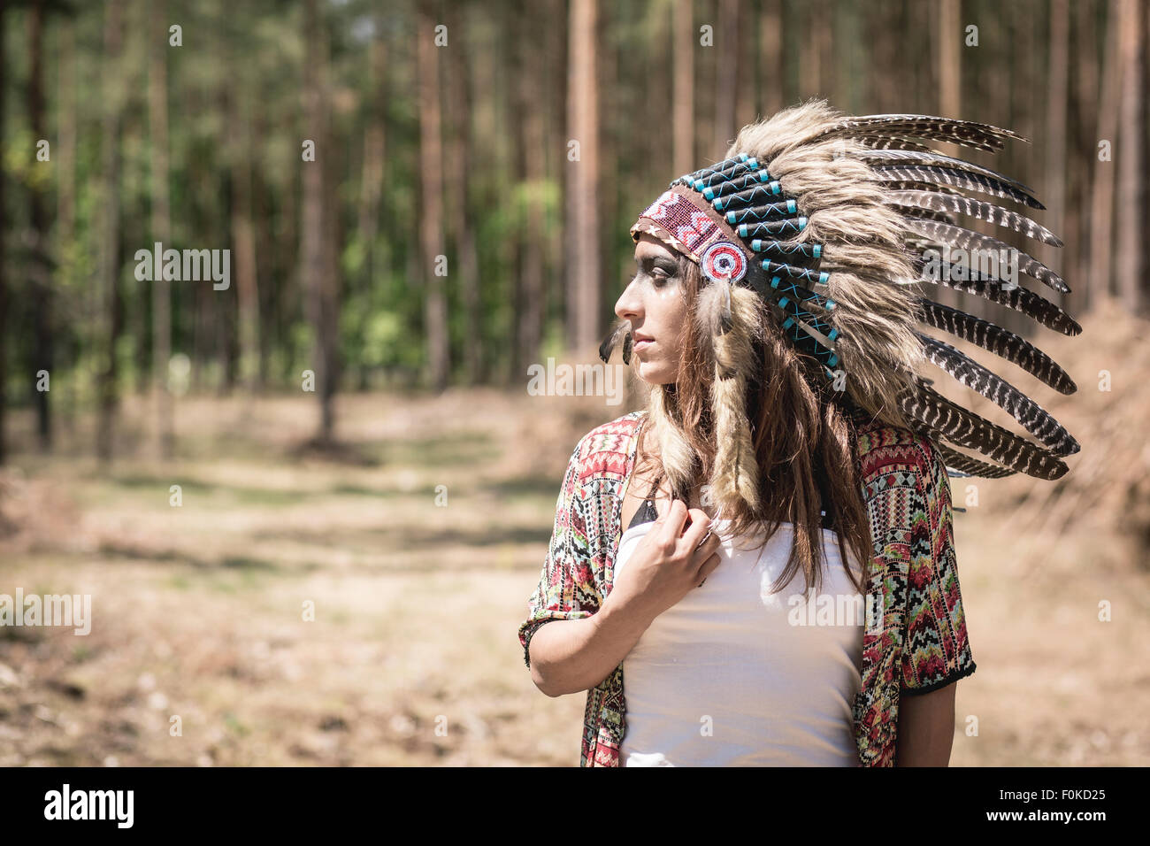 Young woman masquerade as an Indian in the woods Stock Photo - Alamy