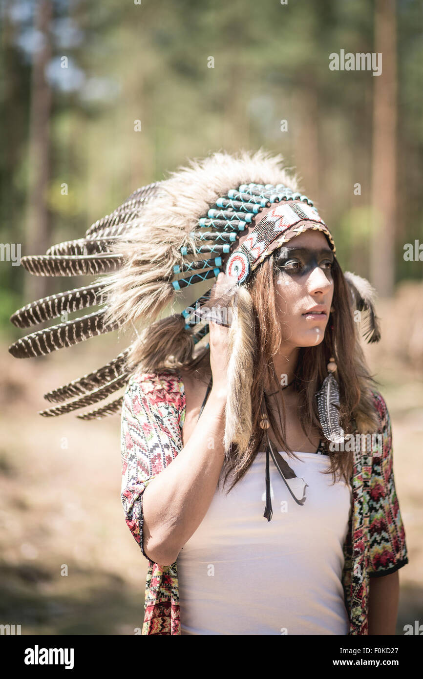 Young woman masquerade as an Indian Stock Photo - Alamy
