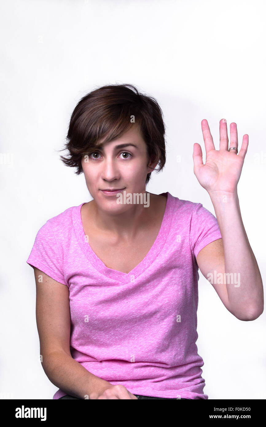 Shyly raising her hand Stock Photo - Alamy