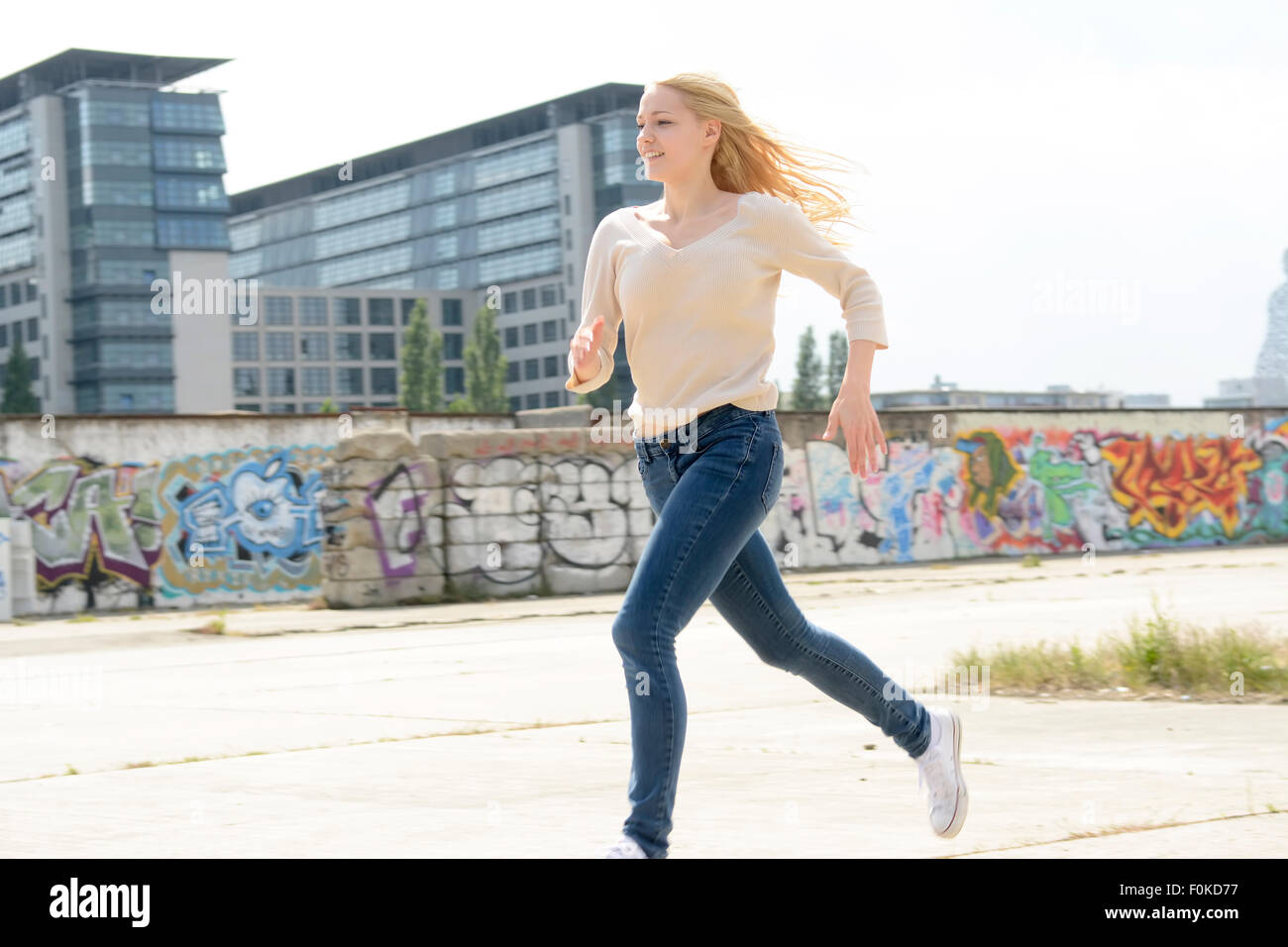 Germany Berlin running woman Stock Photo - Alamy