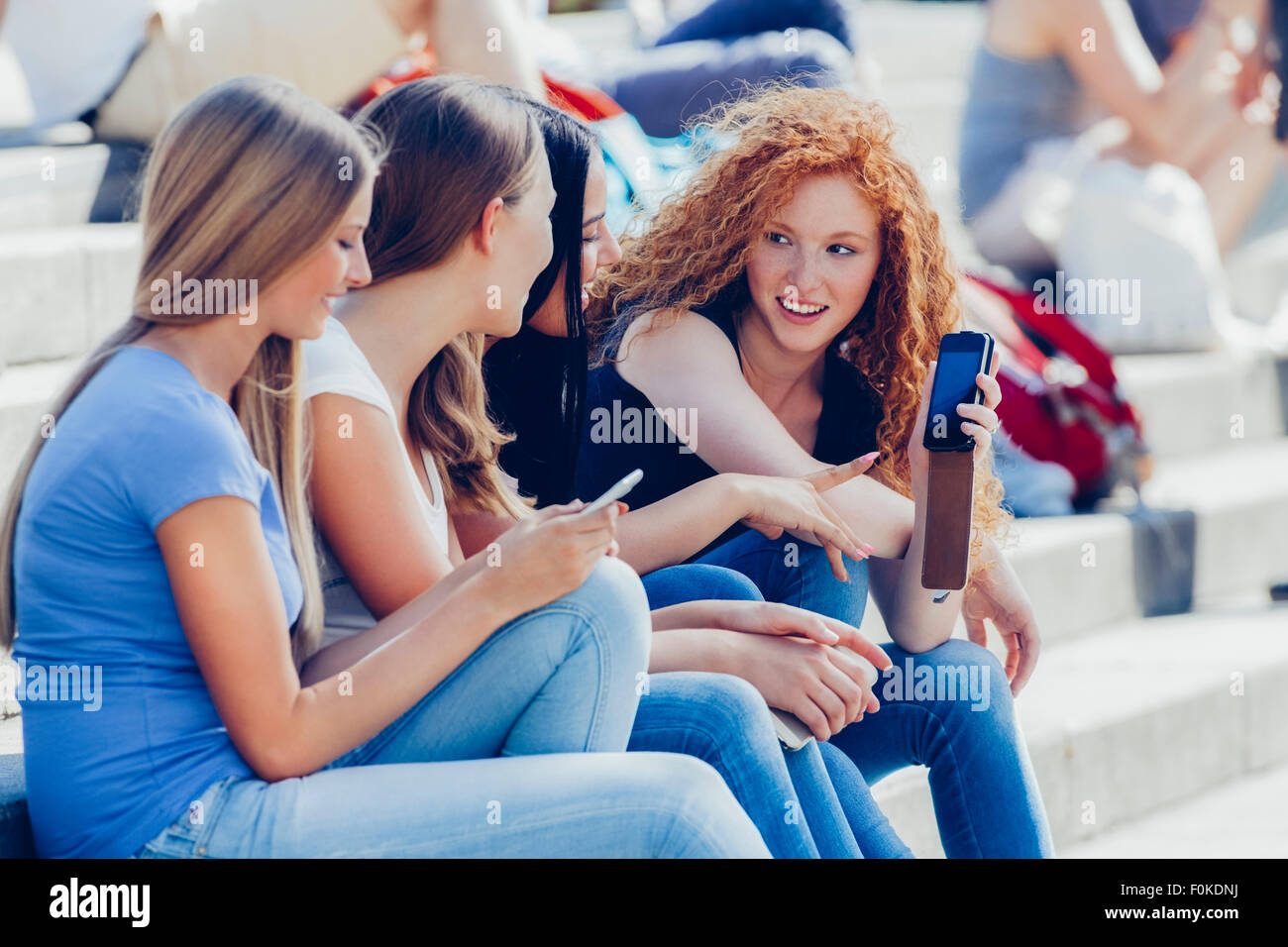 Four teenage girls spending time together Stock Photo - Alamy