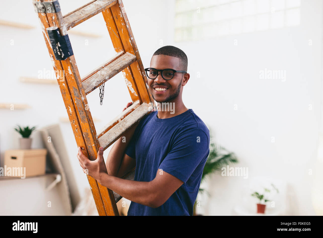One young man up ladder hi-res stock photography and images - Alamy