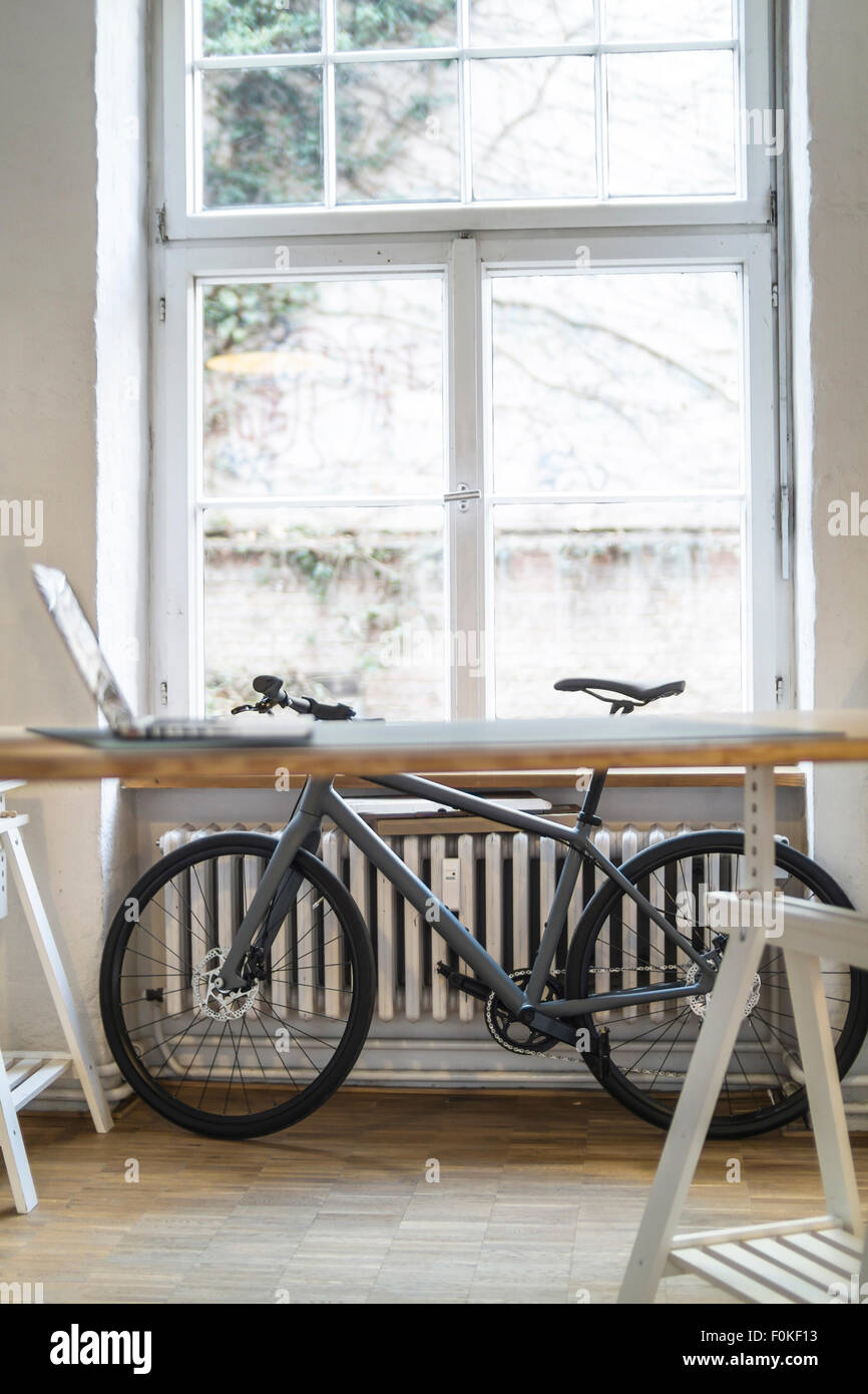 Bicycle in office Stock Photo - Alamy