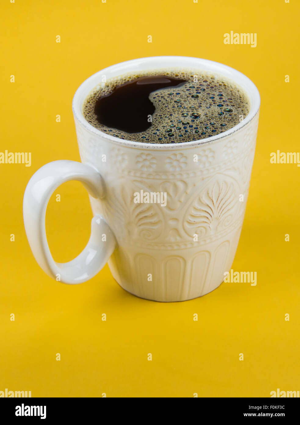 Fresh Coffee pouring into fancy cup on table top Stock Photo - Alamy