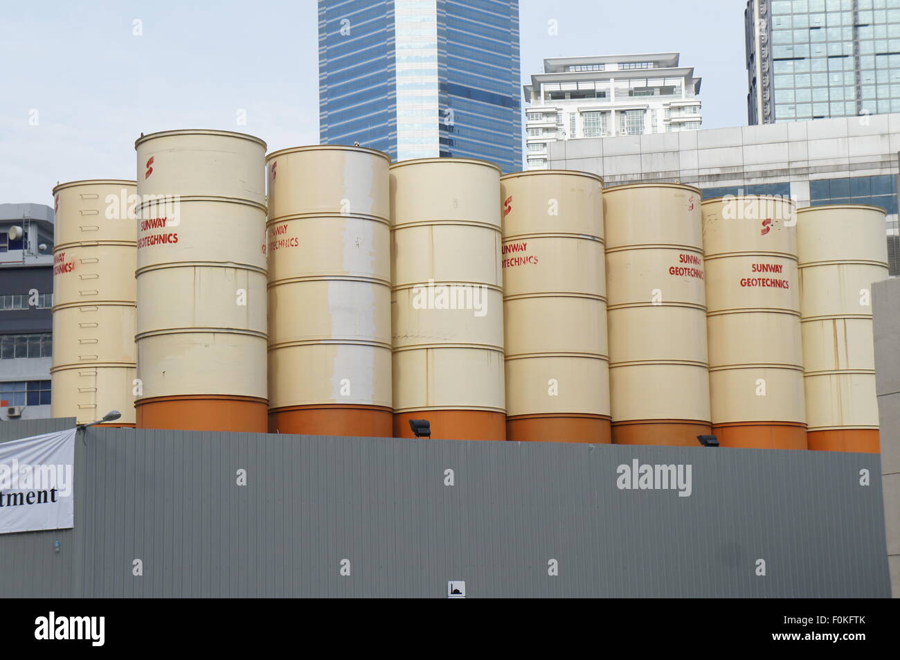 cylindrical vertical storage tanks at construction site Stock Photo - Alamy