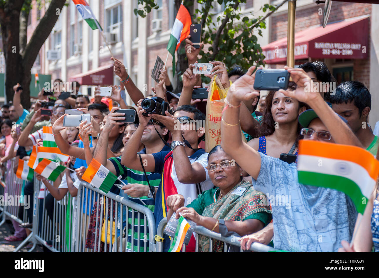 Spectators uses their cell phones and cameras to catch the Indian ...