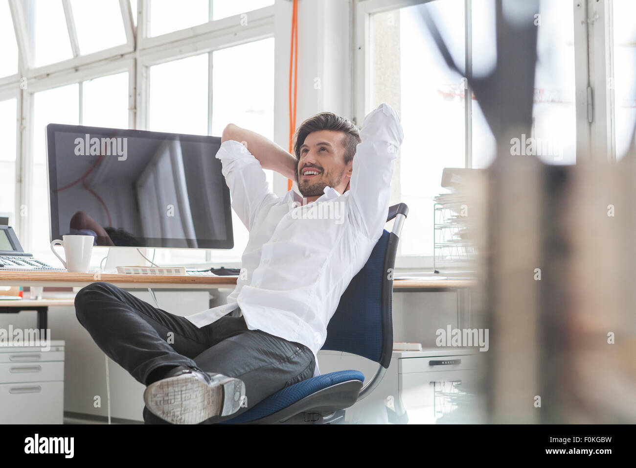Businessman having a rest in his office Stock Photo - Alamy