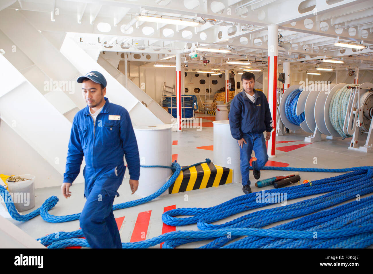 Inside a modern cruise liner Mooring deck with mooring lines ropes on ...