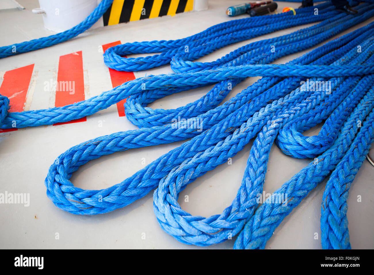 Inside a modern cruise liner Mooring deck with mooring lines ropes on ...