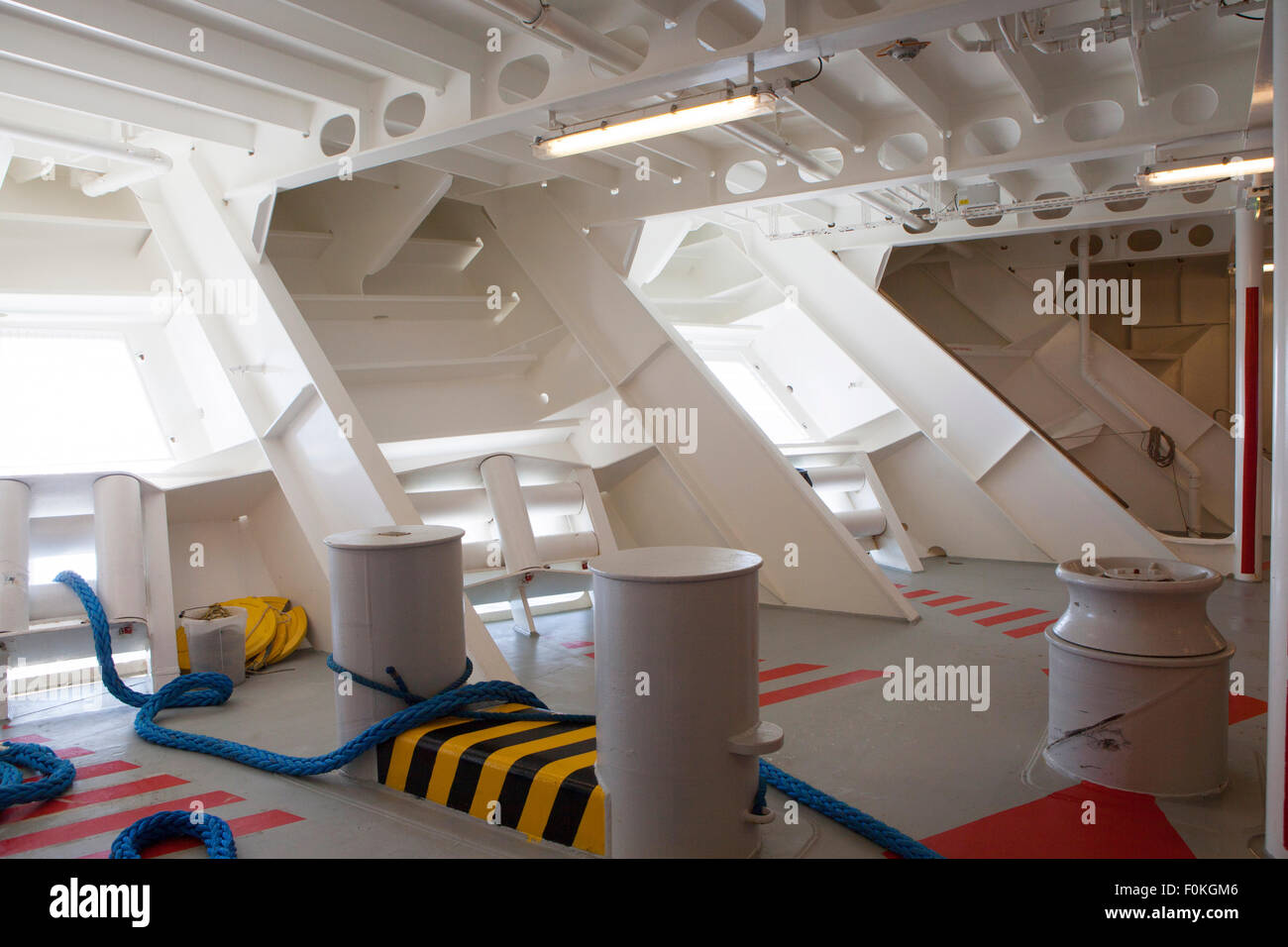 Inside a modern cruise liner Mooring deck with mooring lines ropes on ...