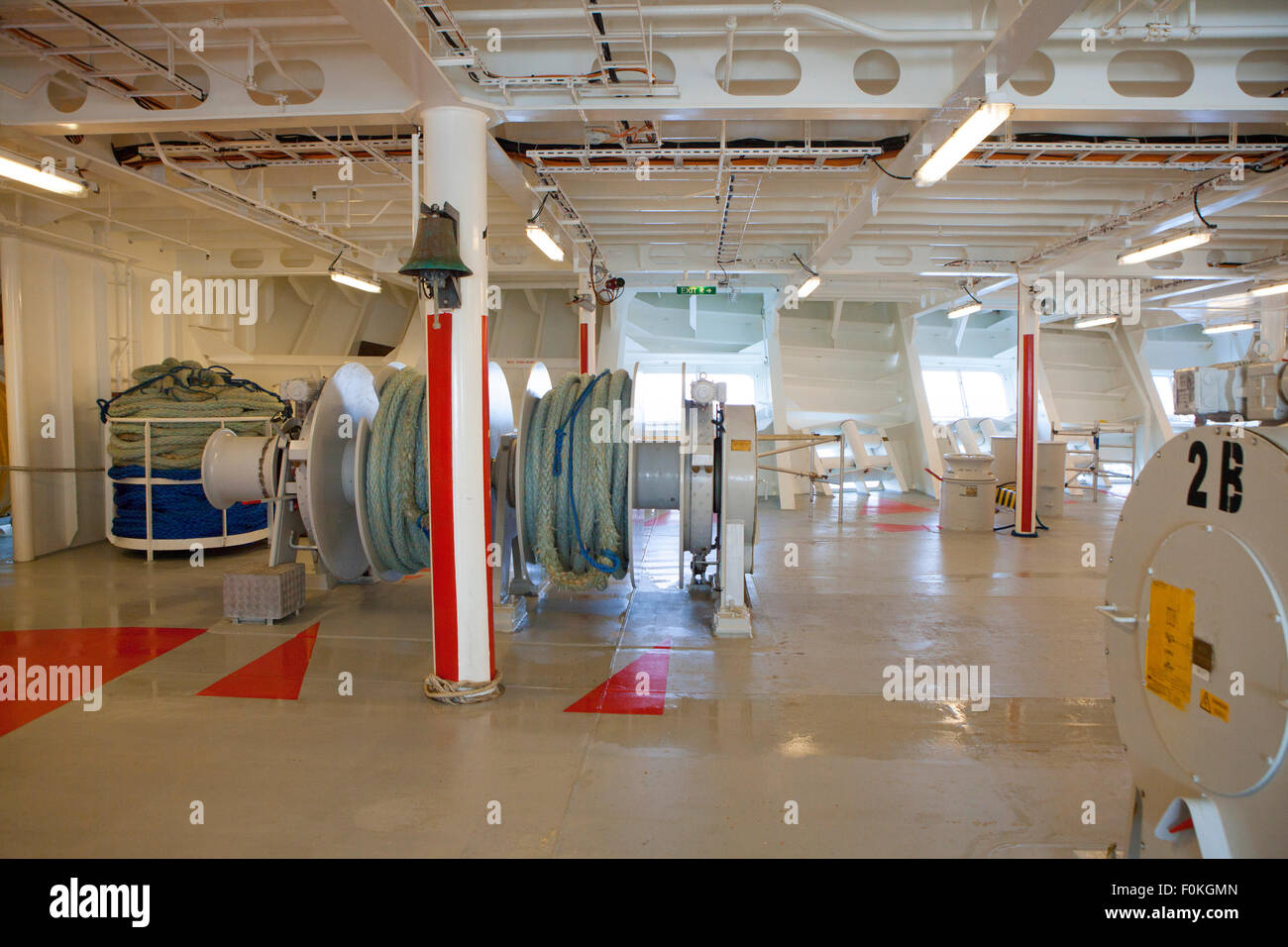 Inside a modern cruise liner Mooring deck with mooring lines ropes on ...