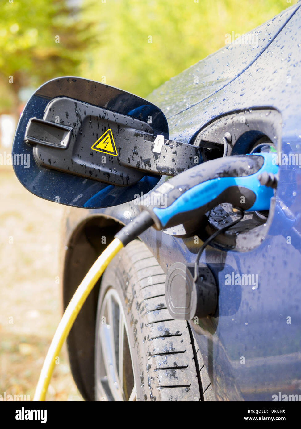 Reloading of an electric car, close-up Stock Photo - Alamy