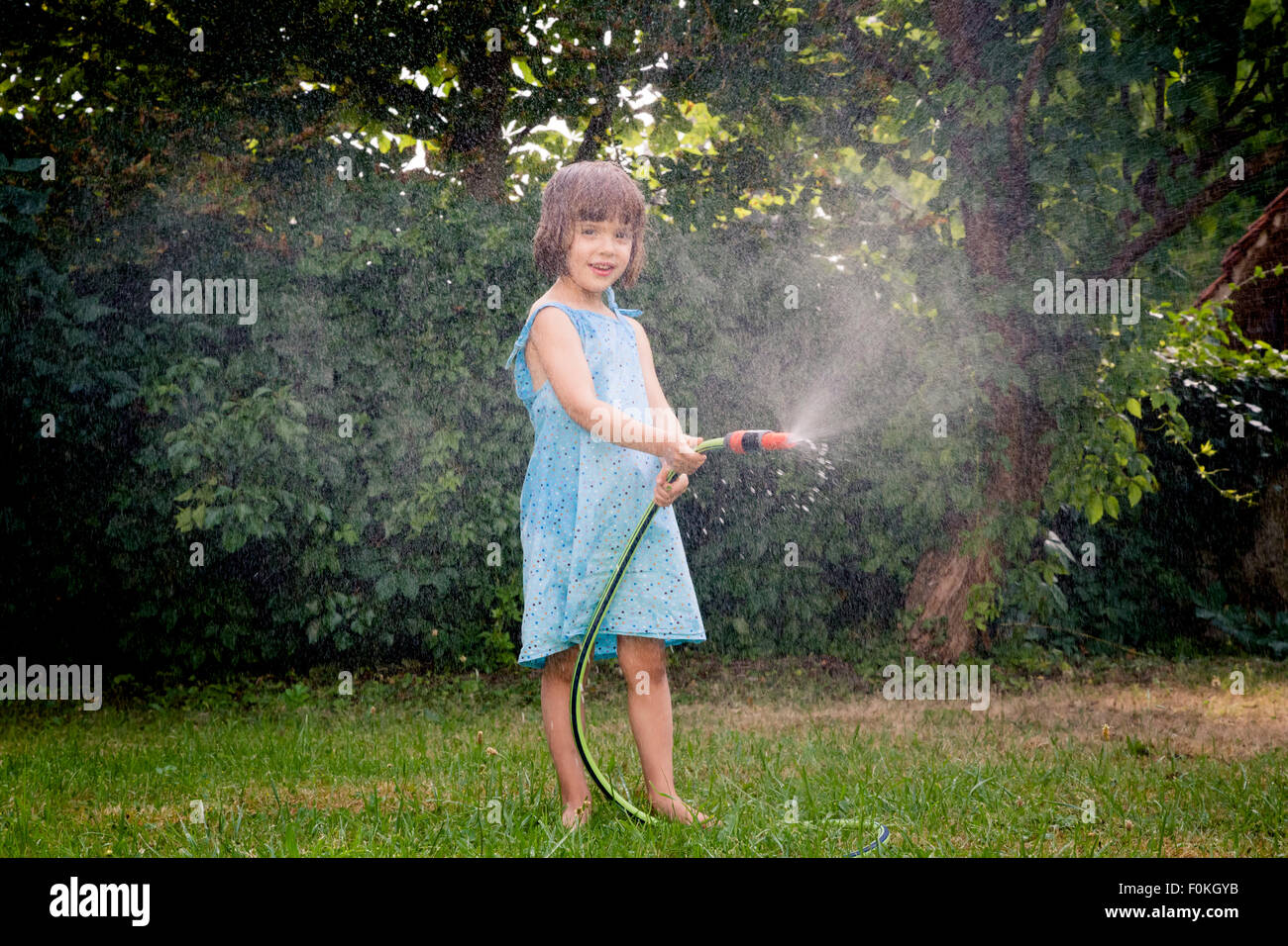 Water hose garden heat girl hi-res stock photography and images - Alamy
