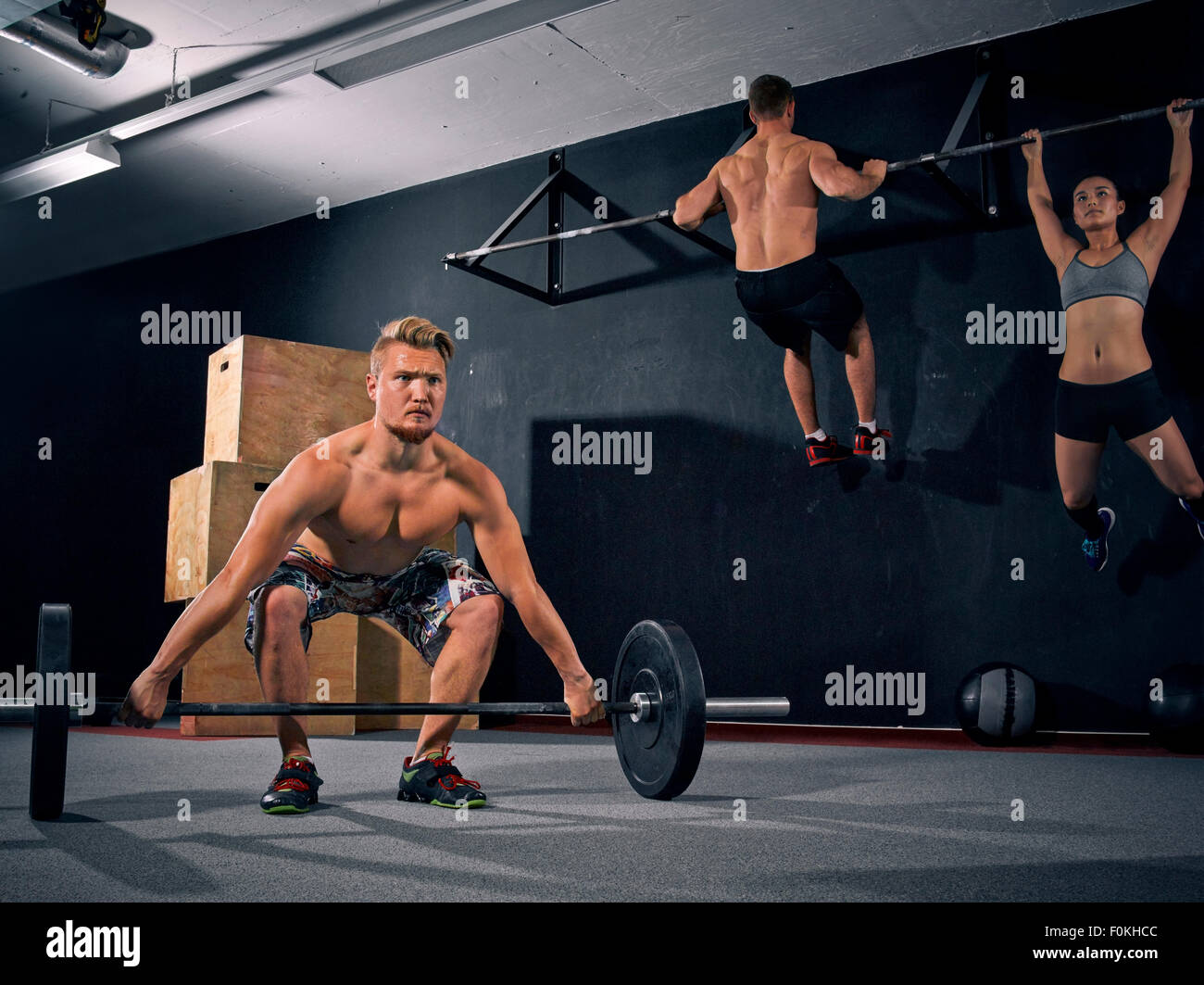 Three CrossFit athletes at workout Stock Photo - Alamy