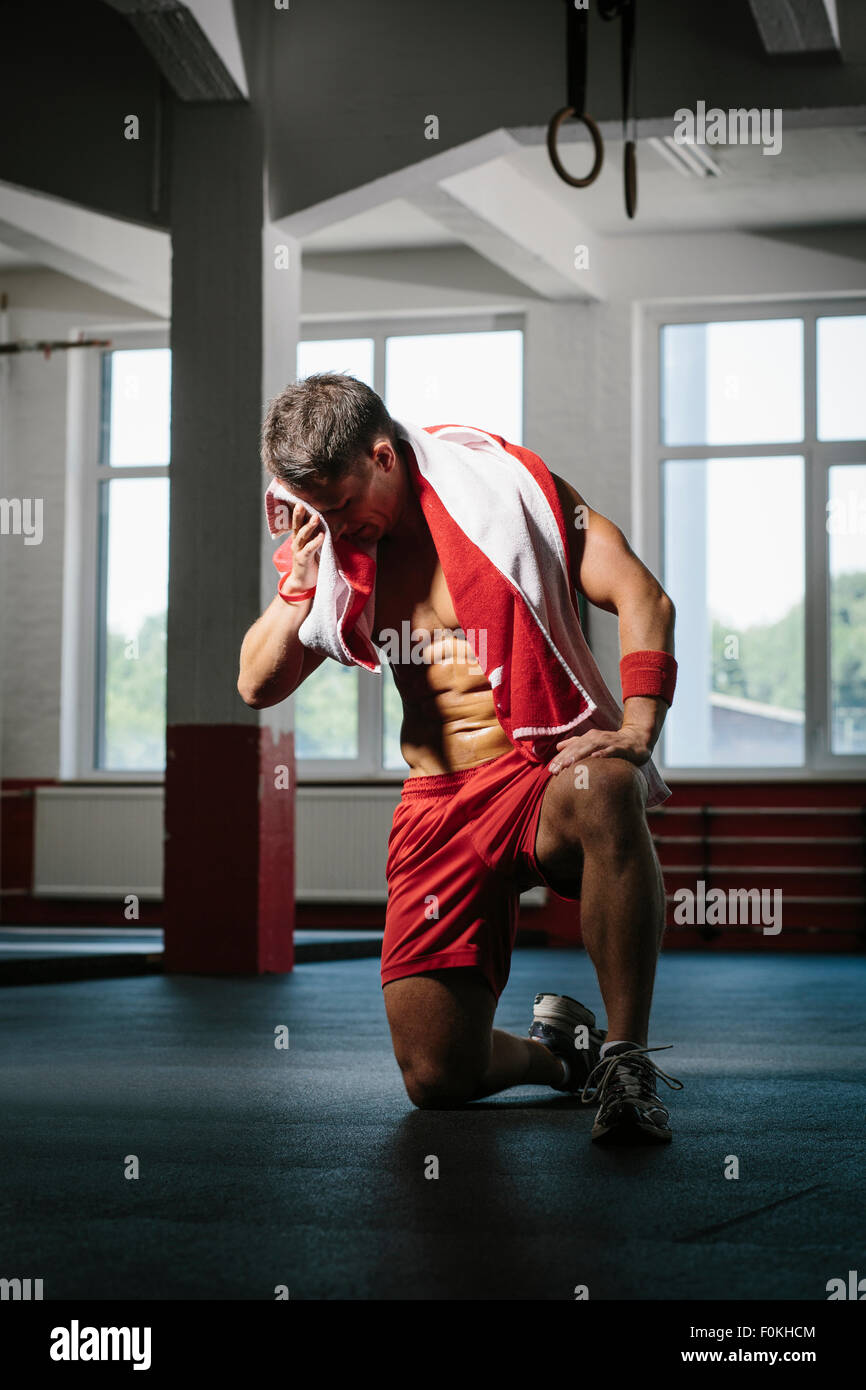 Muscular man wiping off sweat hi-res stock photography and images - Alamy