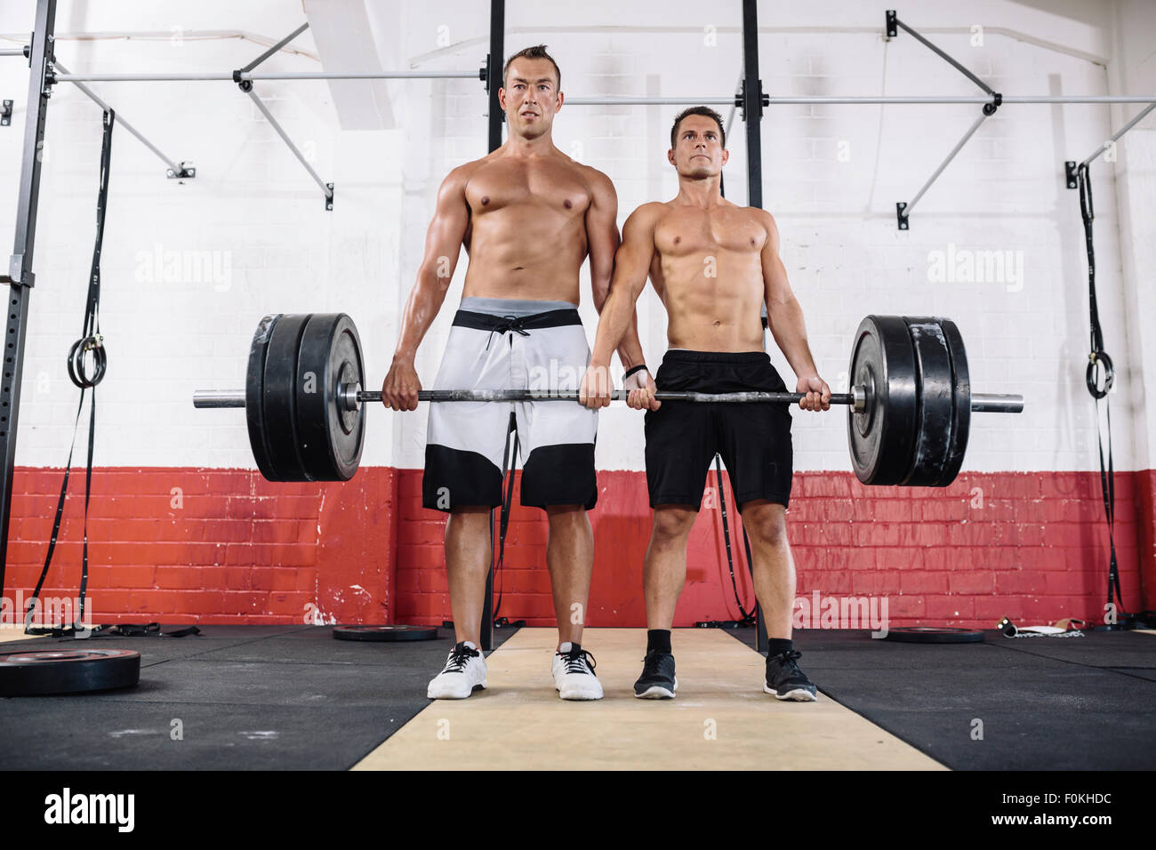 Two CrossFit athletes doing deadlift together Stock Photo - Alamy