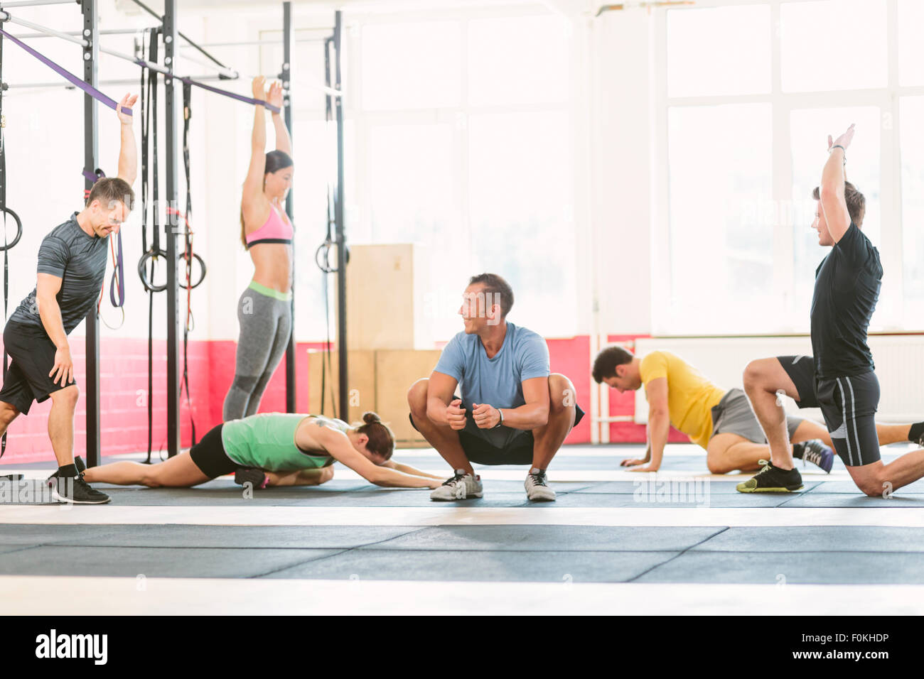 CrossFit athletes doing stretching exercises Stock Photo - Alamy
