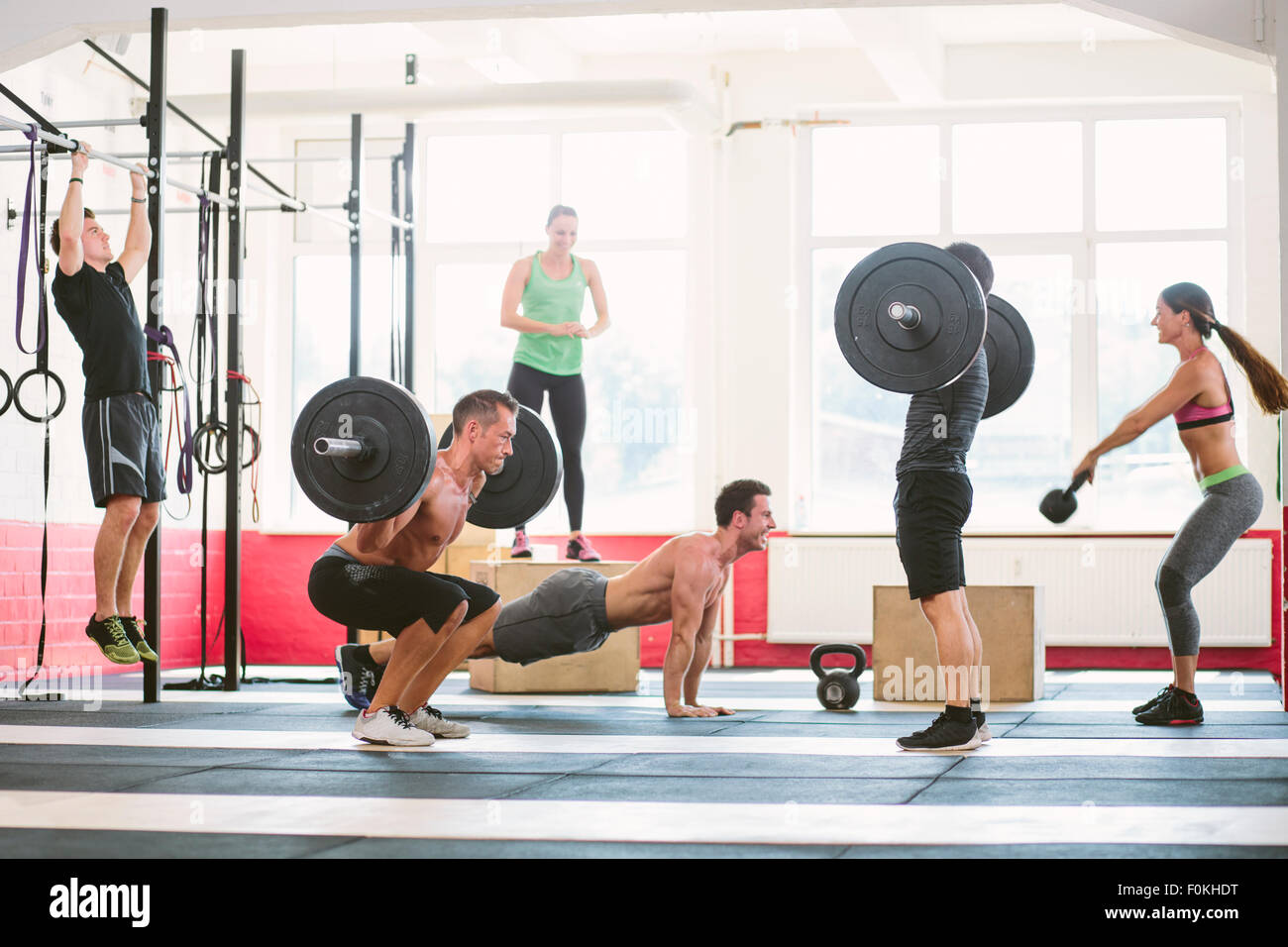 CrossFit athletes exercising in gym Stock Photo - Alamy