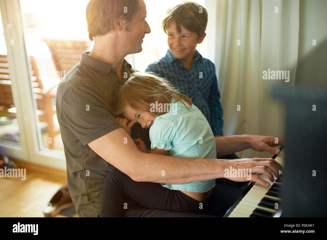 Father and son sitting at piano hi-res stock photography and images - Alamy