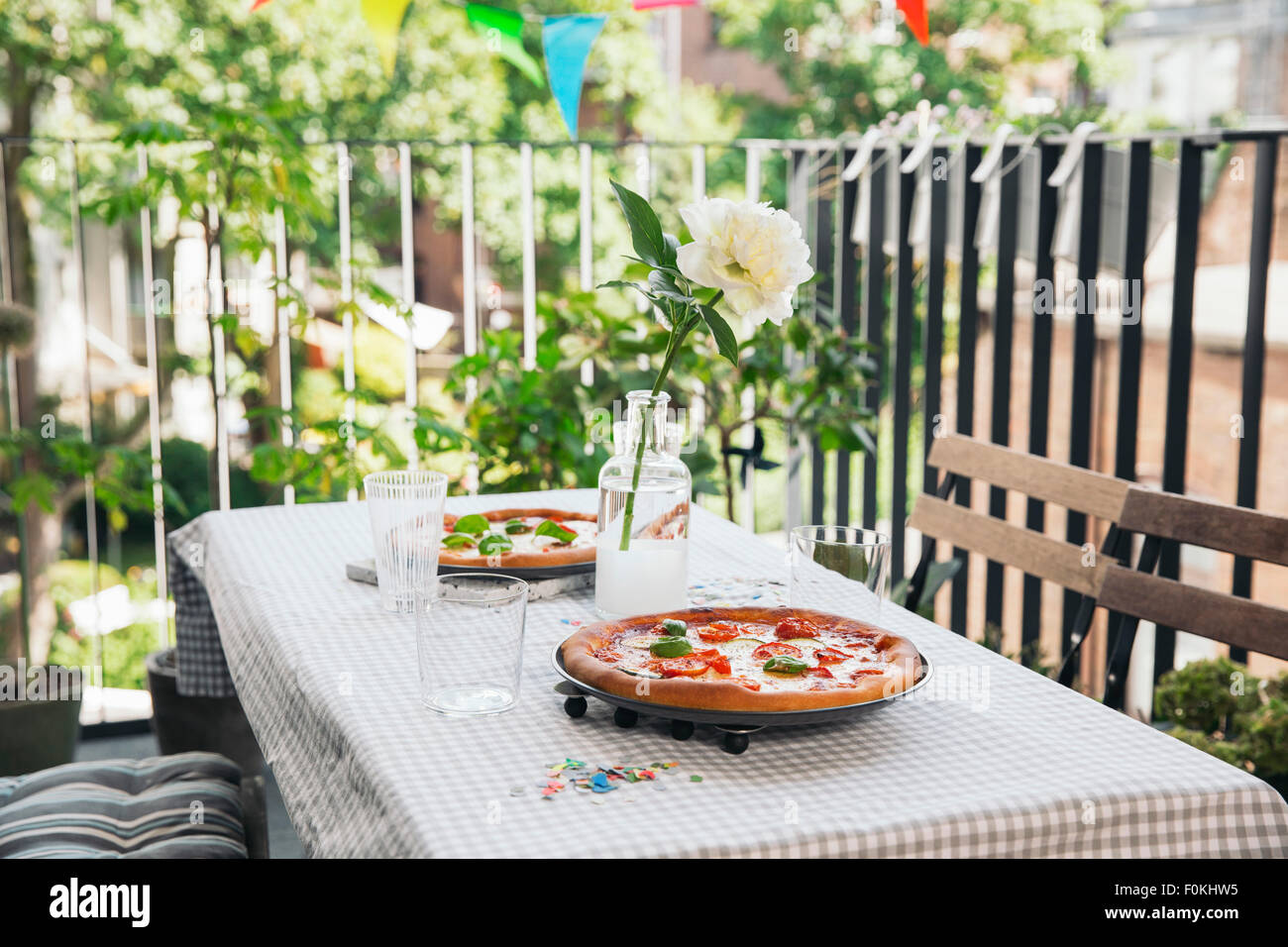Homemade pizza on a laid table Stock Photo - Alamy