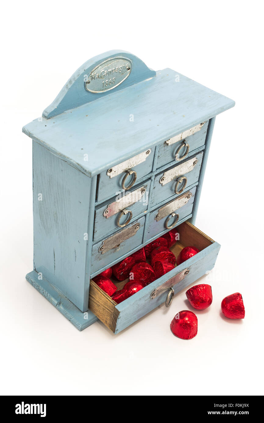 Antique blue box with red candies, isolated on white Stock Photo - Alamy