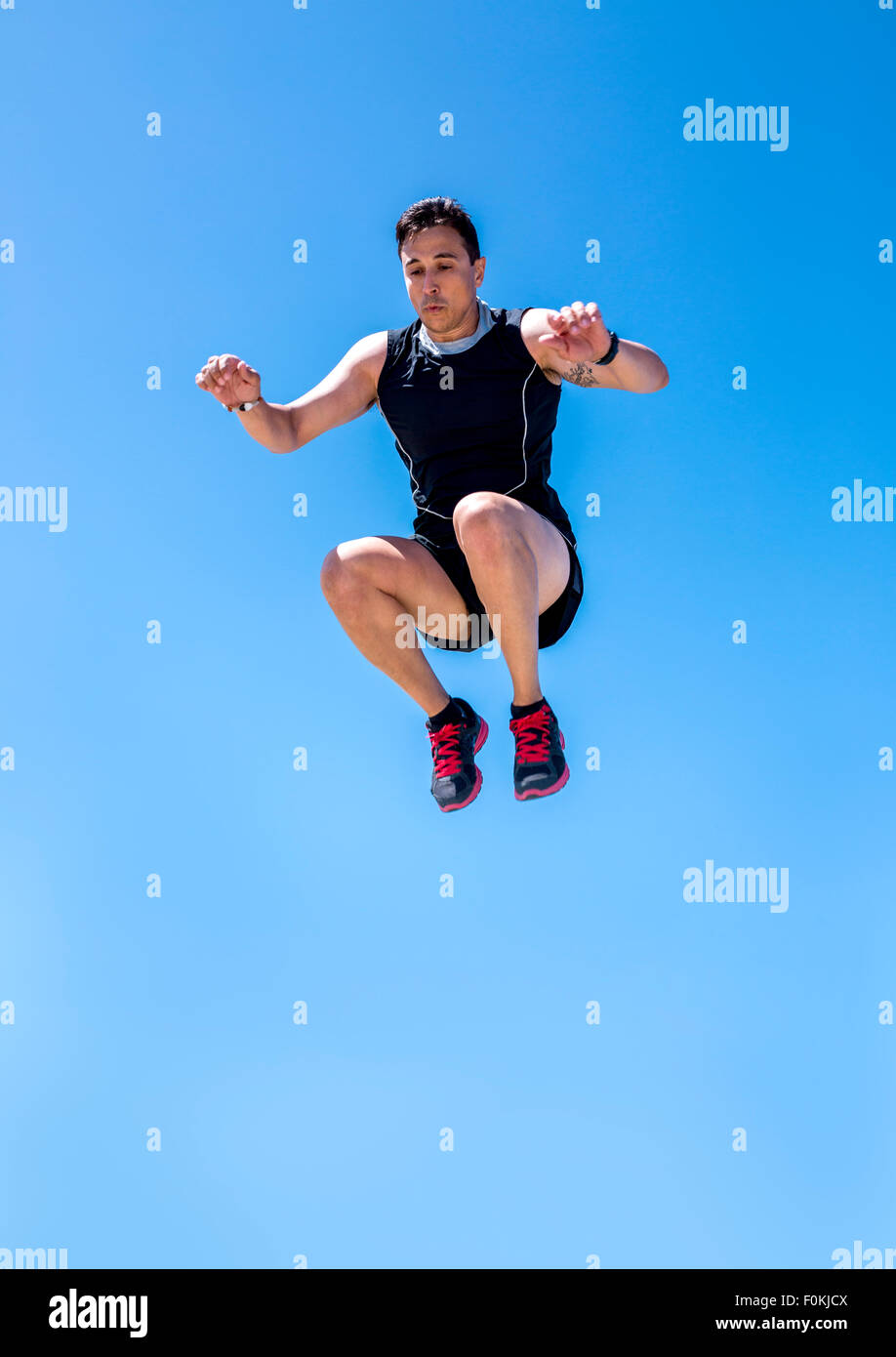 Spain, Athlete jumping, mid-air Stock Photo - Alamy