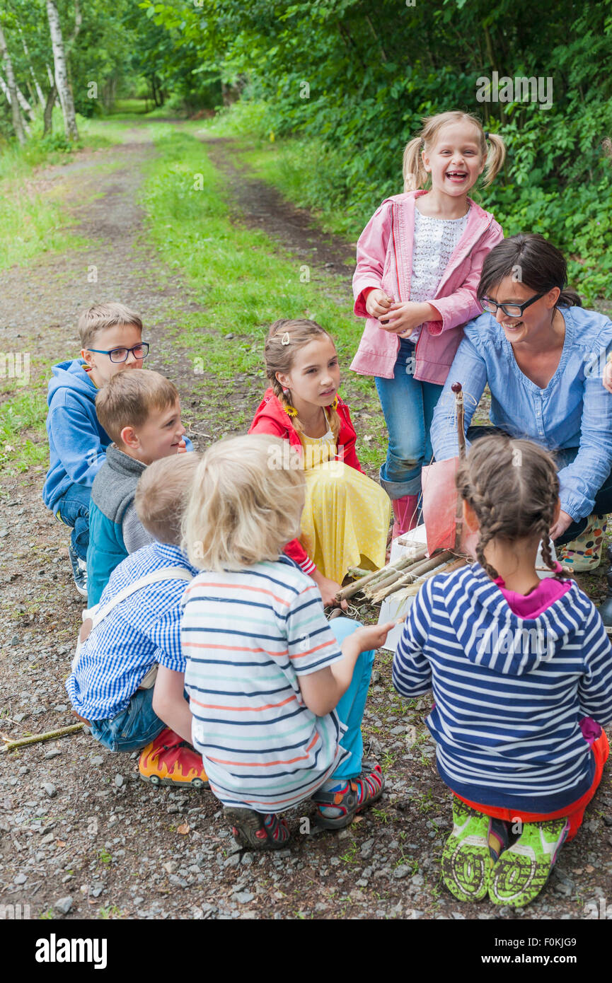 Germany, Children learning how to build a wooden raft Stock Photo - Alamy
