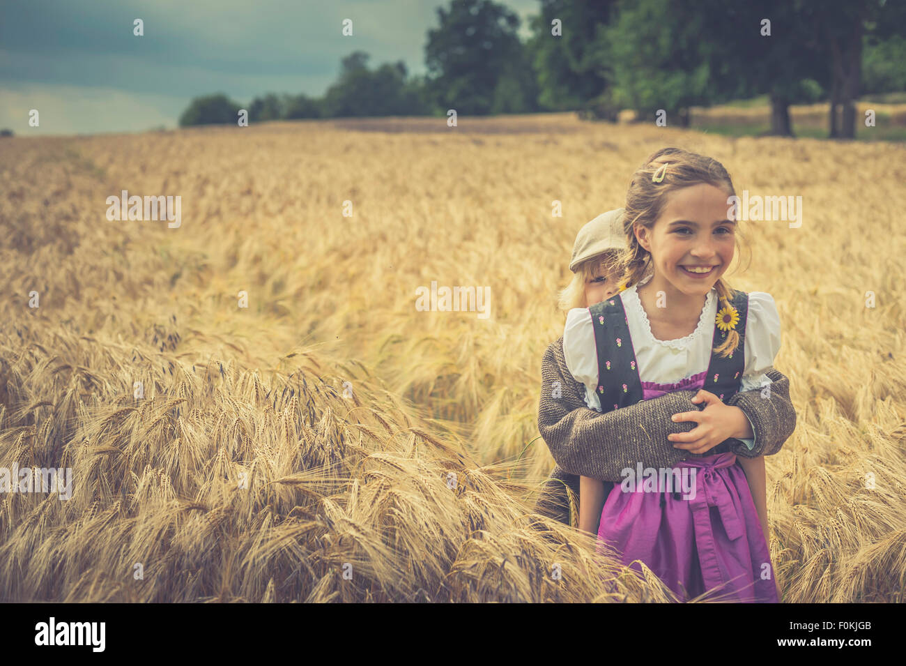 Germany, Saxony, two children standing in a grain field Stock Photo - Alamy