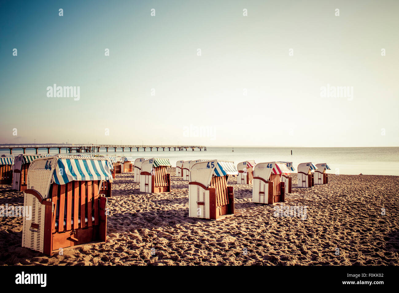 Germany, Niendorf, view to Timmendorfer Strand with hooded beach chairs ...