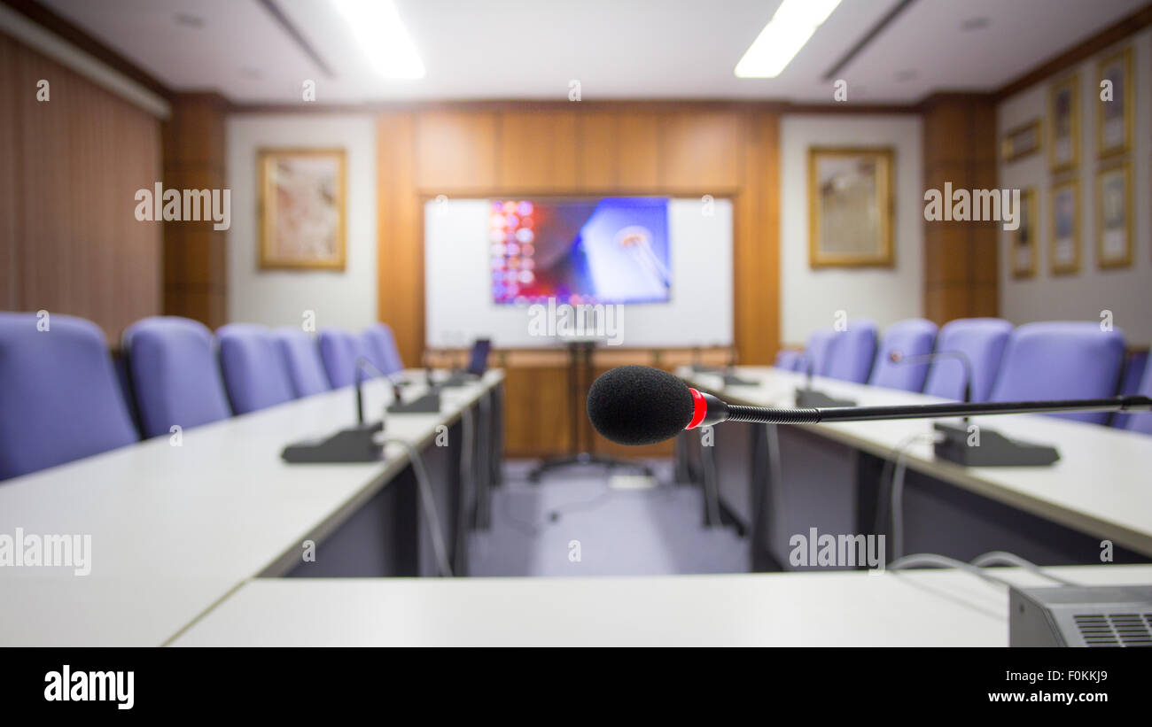 Black conference microphone and LCD screen used for meetings and ...