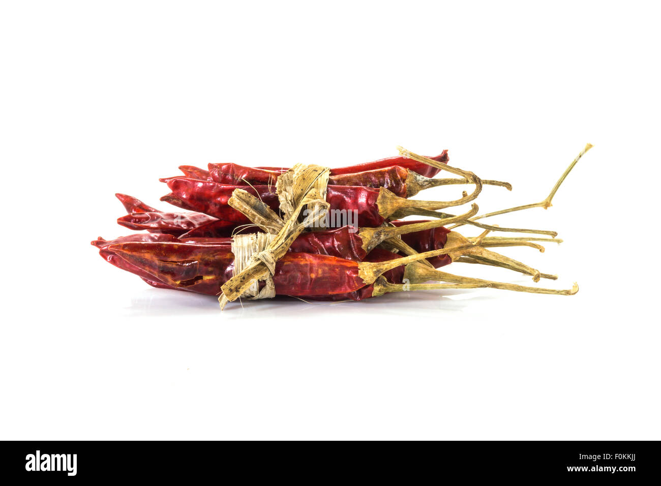 Dried red chilli on a white background Stock Photo - Alamy