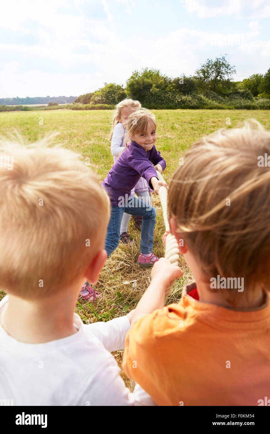 Children playing on a meadow Stock Photo - Alamy