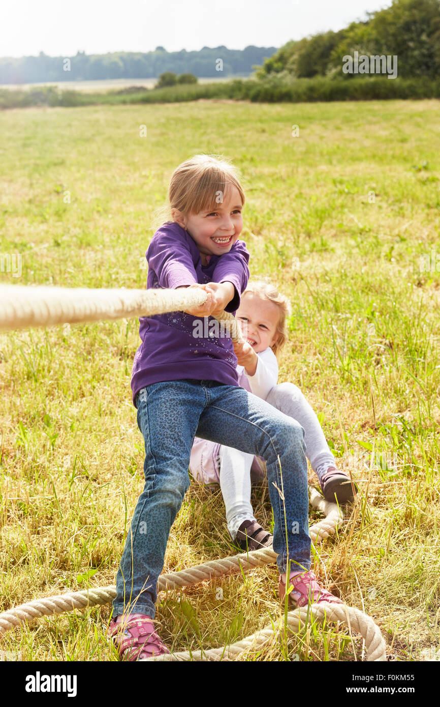 Children playing on a meadow Stock Photo - Alamy