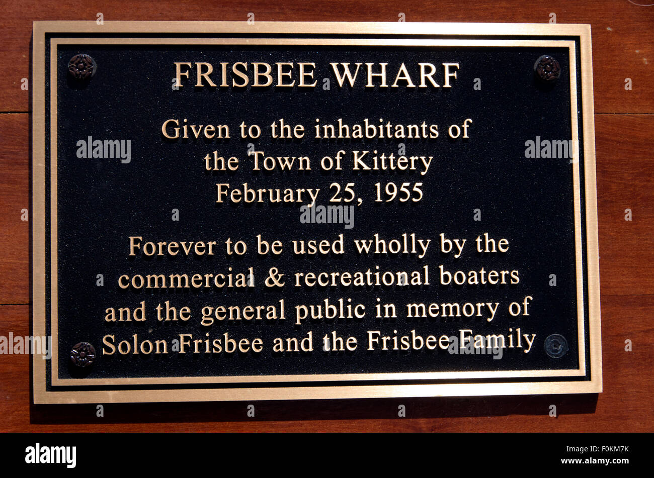 Frisbee Wharf comerative sign hangs by harbor, harbour Stock Photo - Alamy