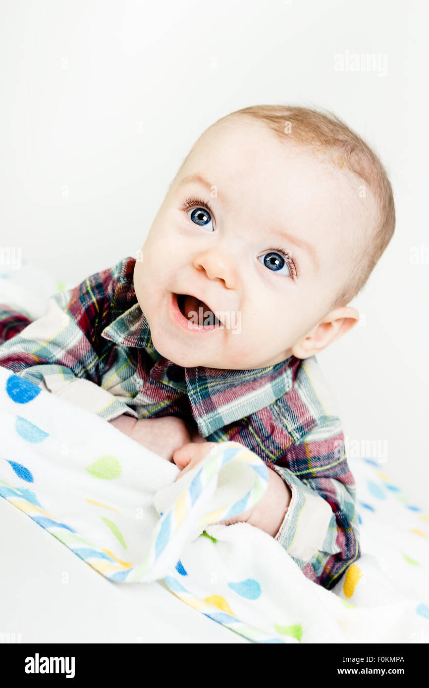Adorable happy baby with blue eyes. studio photo Stock Photo - Alamy