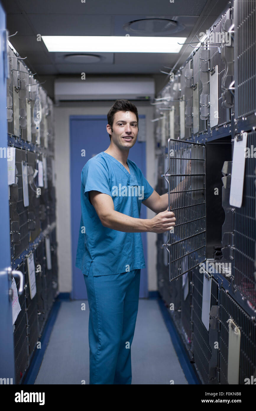 Veterinarian at pet cages in animal hospital Stock Photo - Alamy