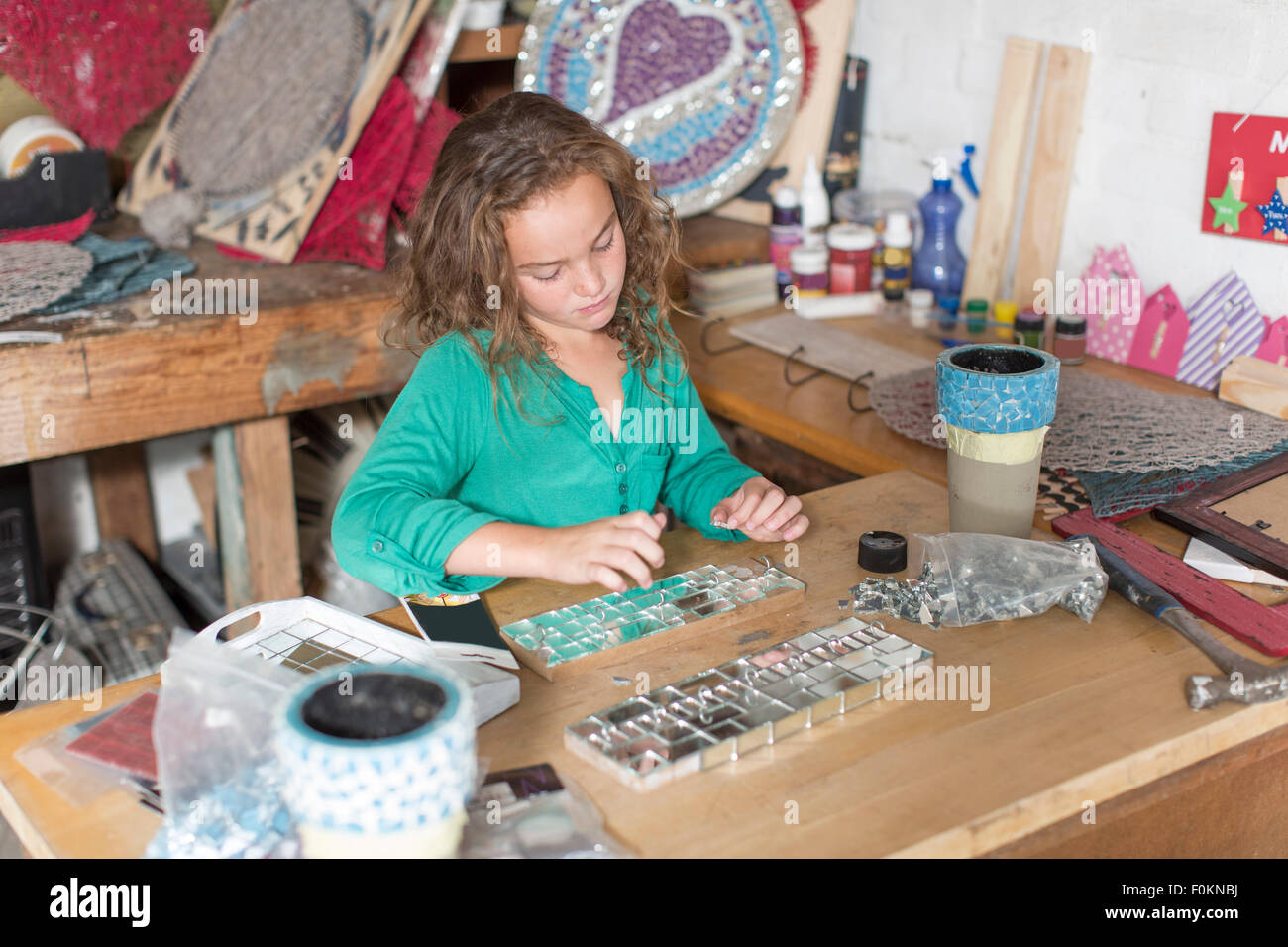 Girl doing crafts in home garage Stock Photo - Alamy