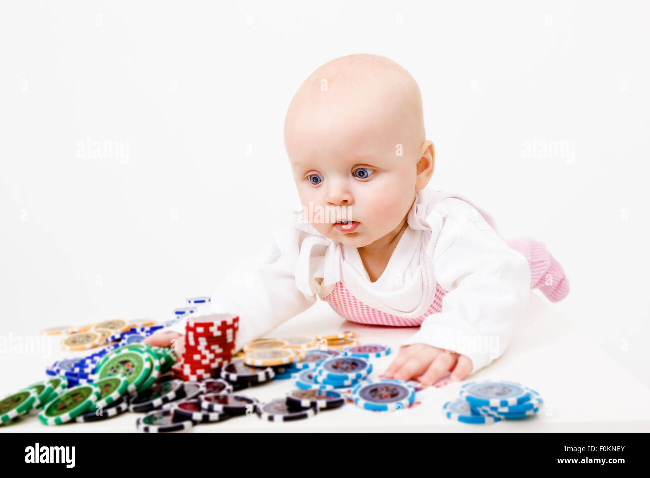 infant with chips from the casino. studio Stock Photo - Alamy