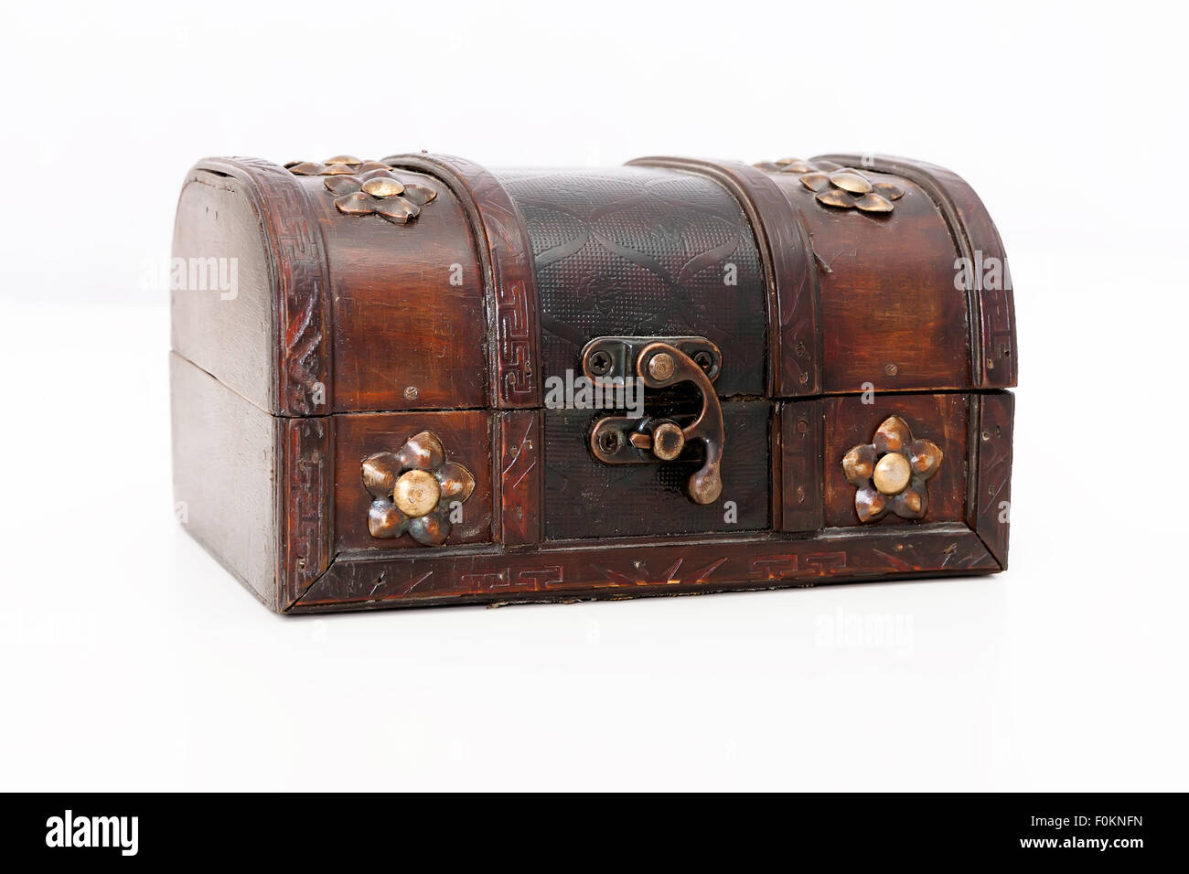Closed chest on a light background. Wood with bronze Stock Photo - Alamy