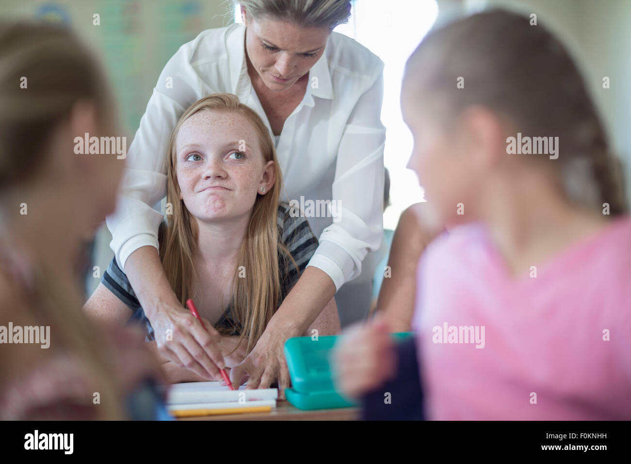 Teacher correcting student hi-res stock photography and images - Alamy