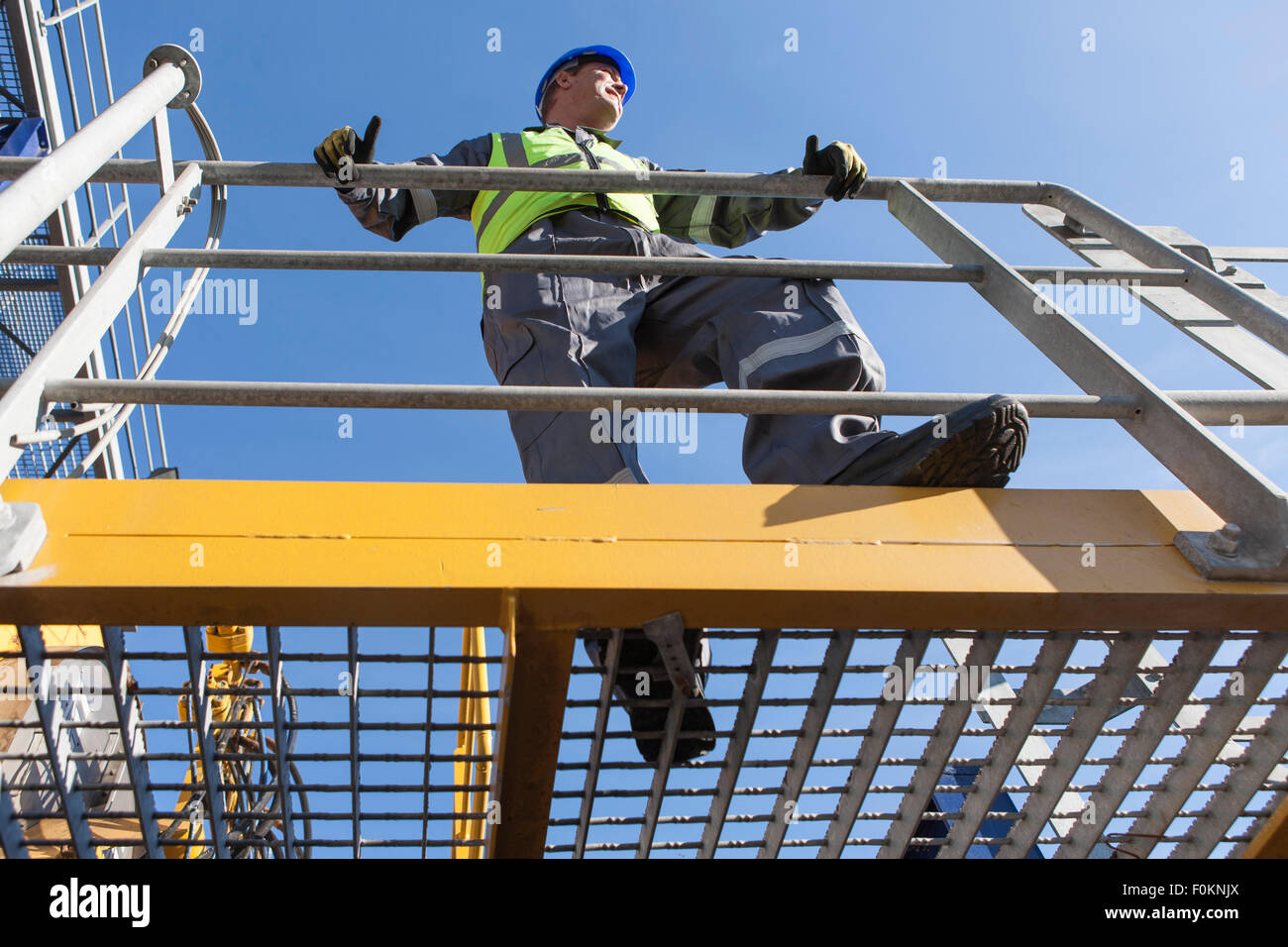 Man standing onboard a ship Stock Photo - Alamy
