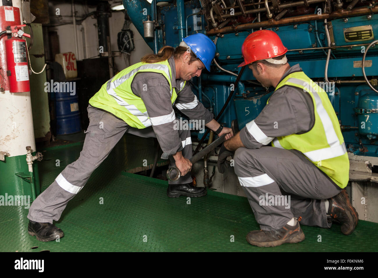 Crew working in engine room on a ship Stock Photo - Alamy