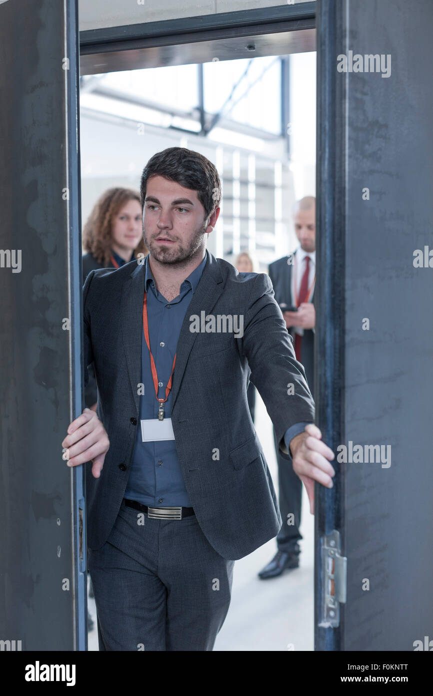Group of business people entering office Stock Photo - Alamy