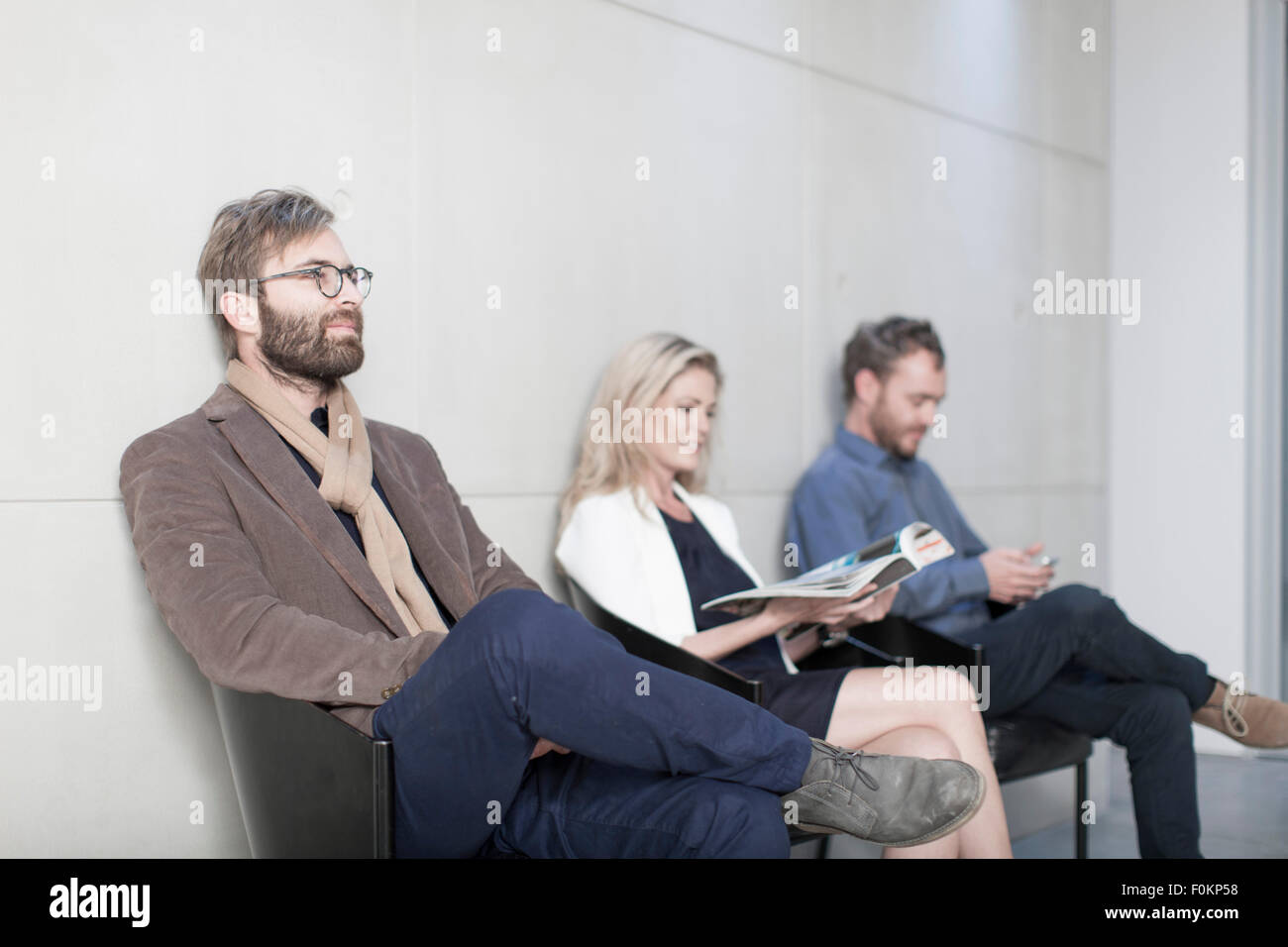 People sitting in waiting room Stock Photo - Alamy